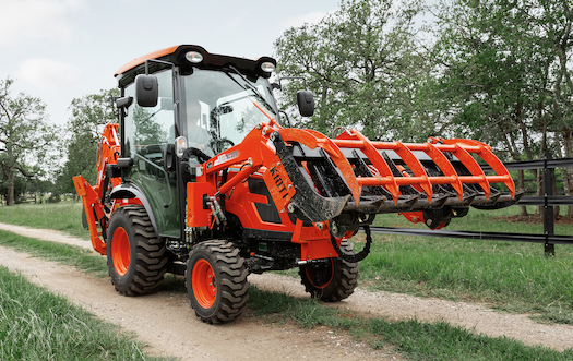 Kioti Grapples and CX2510 HST Cab Tractor - Contractor Supply Magazine